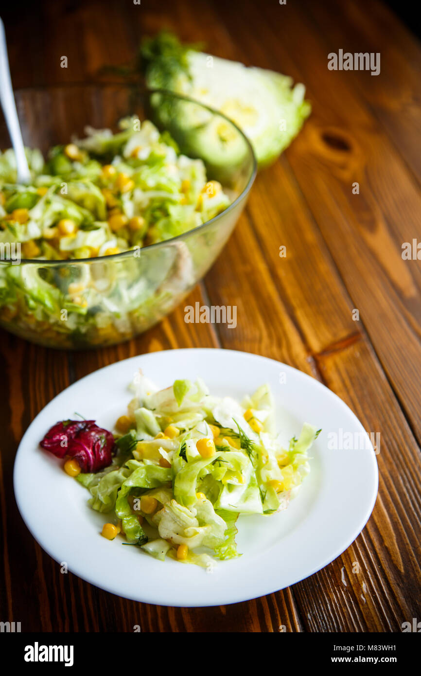 fresh salad of young cabbage with sweet corn Stock Photo - Alamy