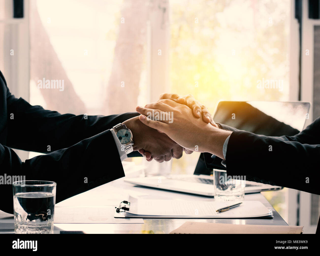negotiations and business success concept, businessmen shaking hands or ...