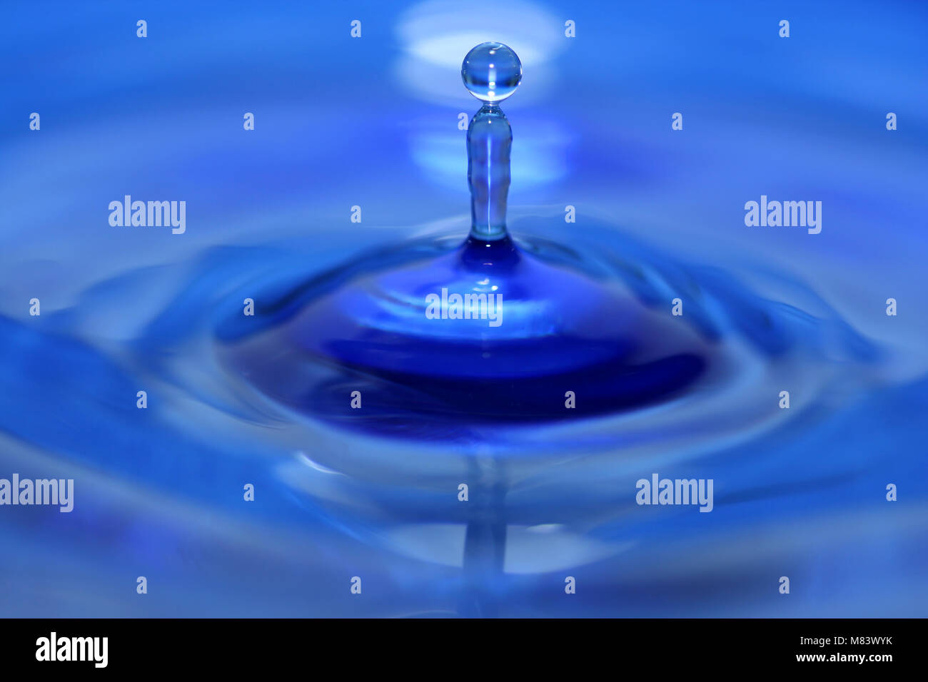 A blue water droplet splashing Stock Photo - Alamy