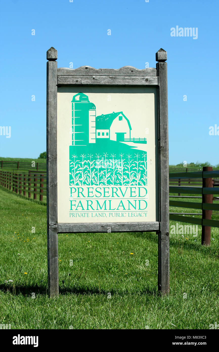 A Preserved farmland sign with grass and sky Stock Photo - Alamy