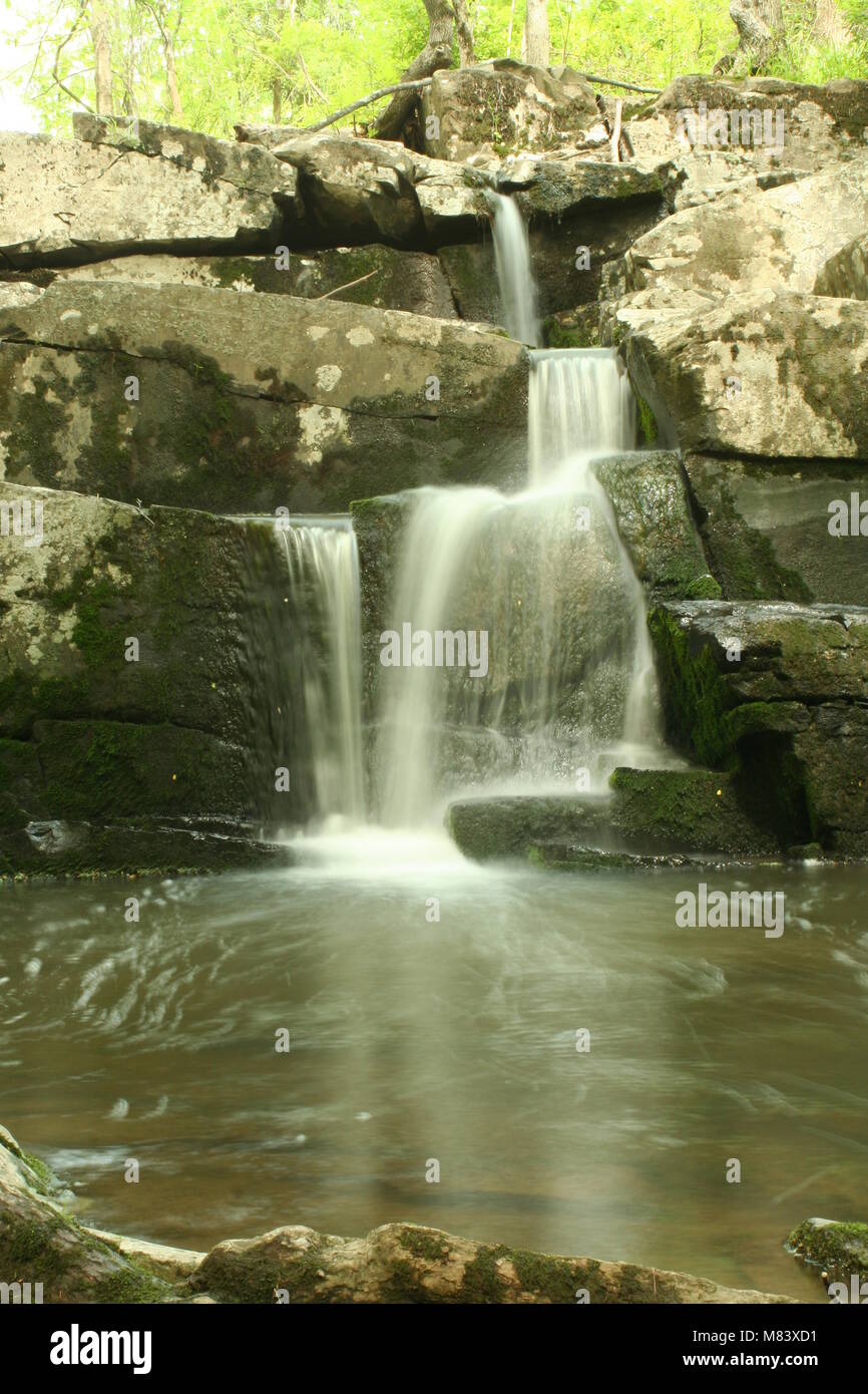A flowing waterfall with silky water Stock Photo - Alamy