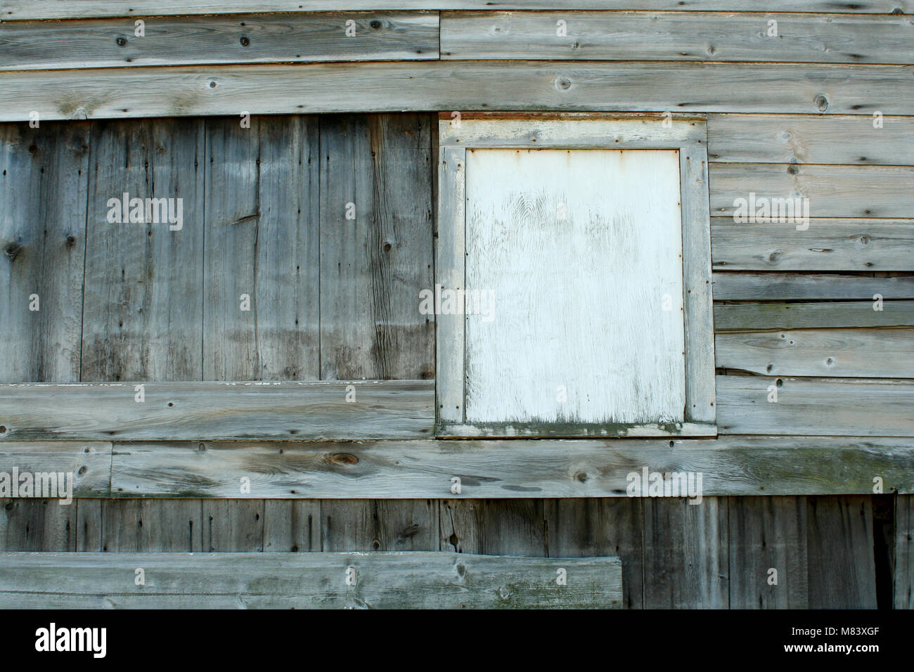 a Old boarded up barn window Stock Photo - Alamy