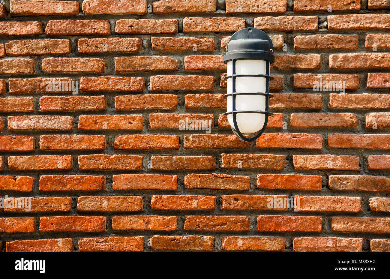 Lightbulb on brick wall hi-res stock photography and images - Alamy