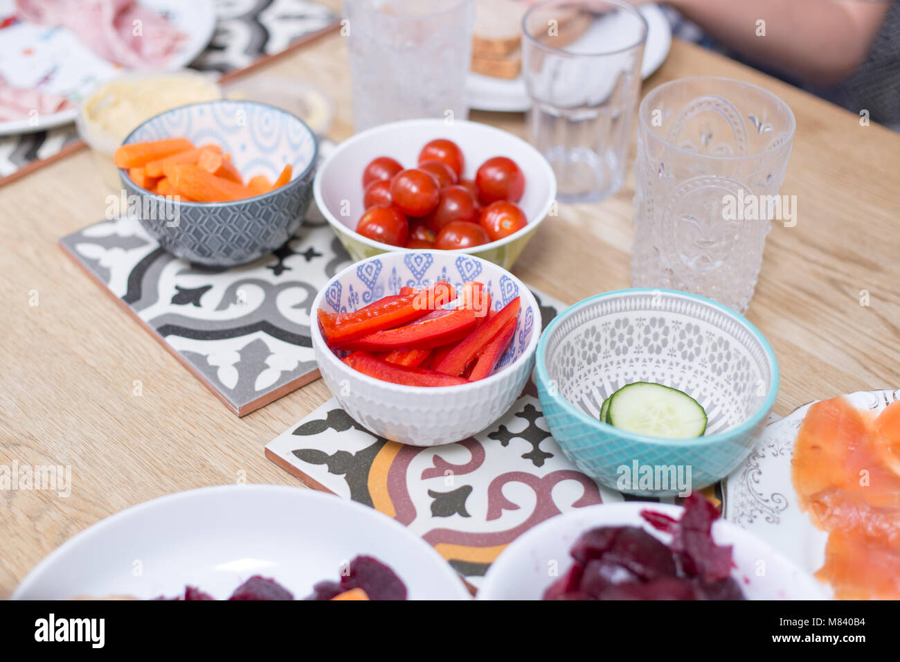 Food snacks laid out on a kitchen table Stock Photo - Alamy