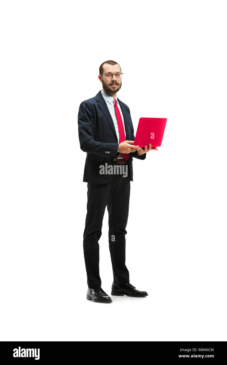 Picture of handsome young bearded man standing over white studio ...
