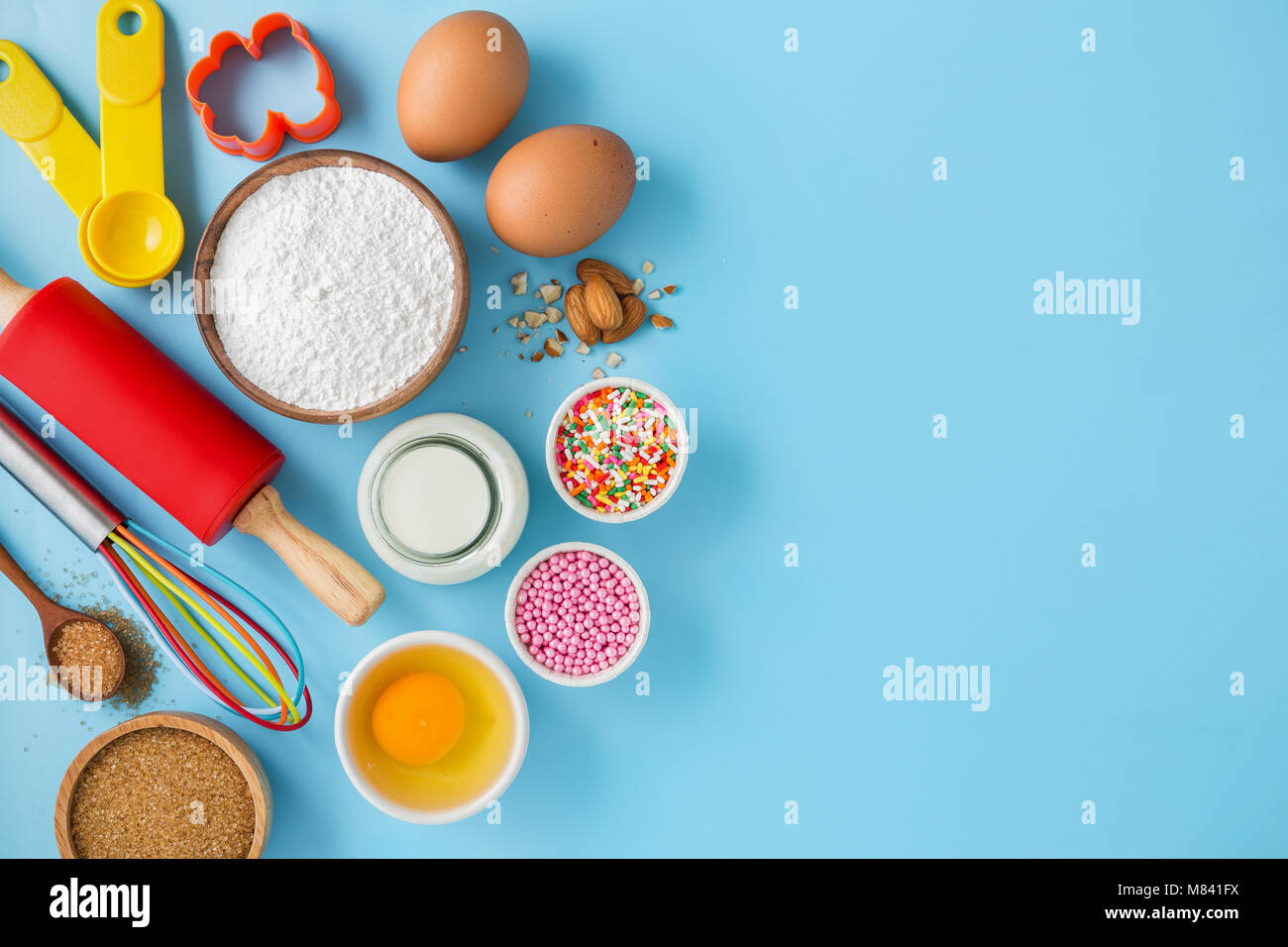Baking background with ingredients eggs, flour, milk, sugar and cake ...