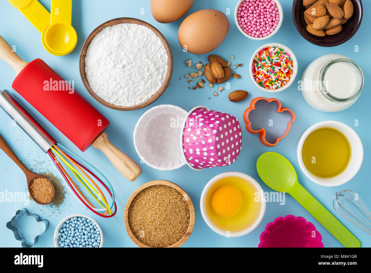 Baking cupcakes with ingredients eggs, flour, milk, sugar and cake ...