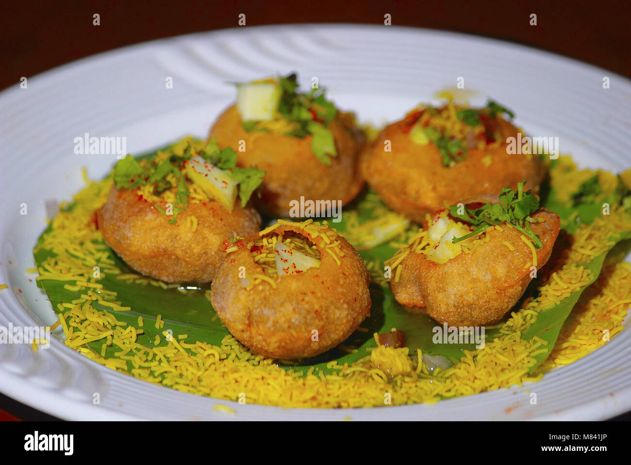 Pani Puri. Common street snack consisting of a round, hollow puri ...