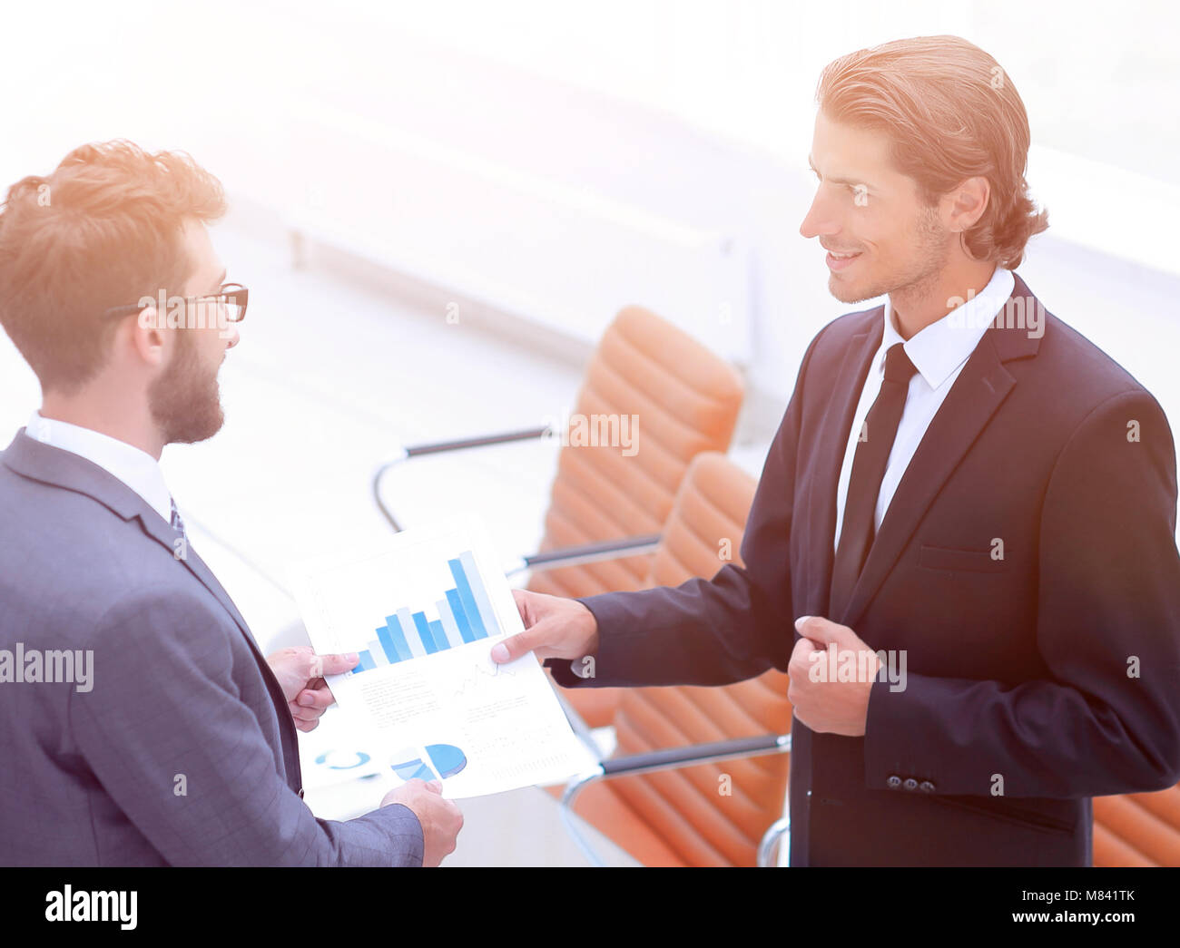 two businessmen talking in the office Stock Photo - Alamy