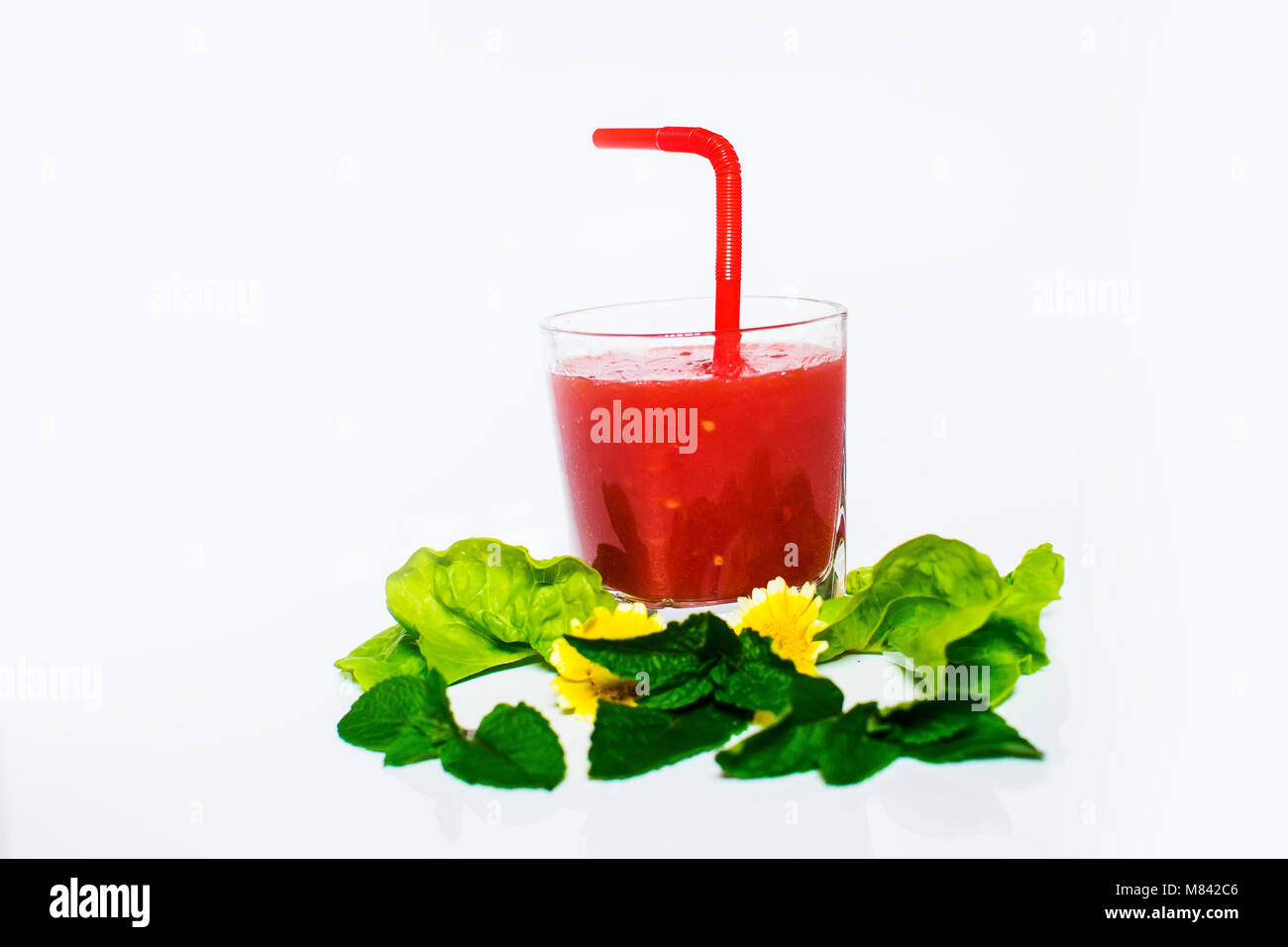 Healthy tomato smoothie in a glass isolated on white background Stock ...