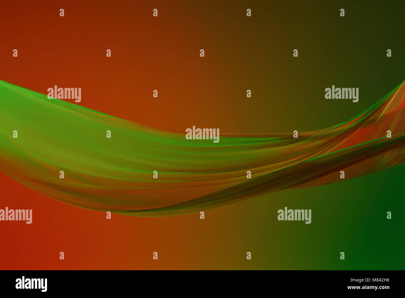 Smooth elegant transparent green cloth on green colored background ...