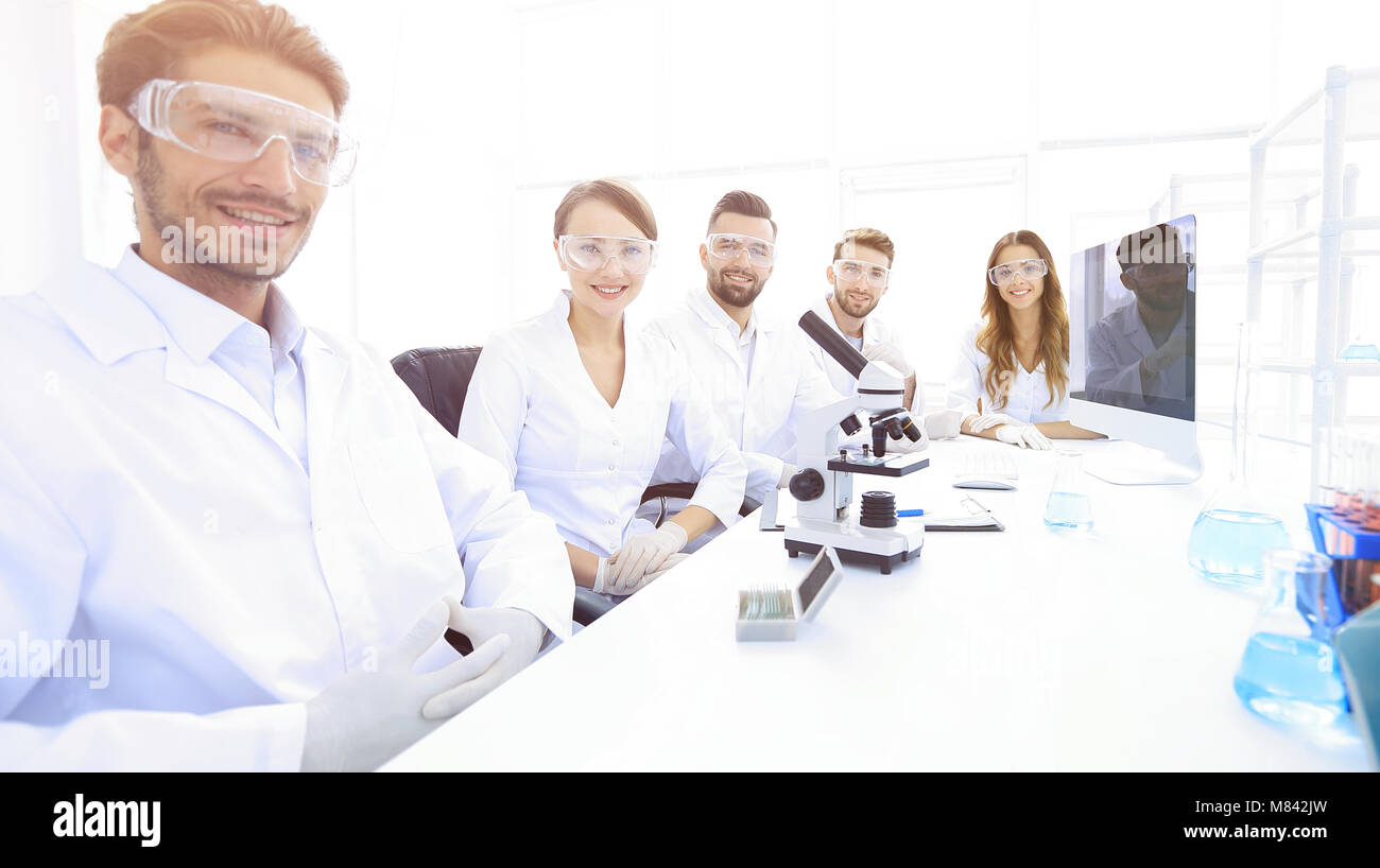 Male scientist and the team in the lab Stock Photo - Alamy