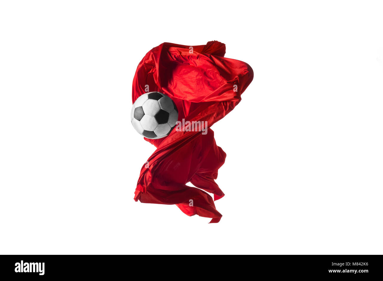 Soccer ball and Smooth elegant transparent red cloth isolated or ...