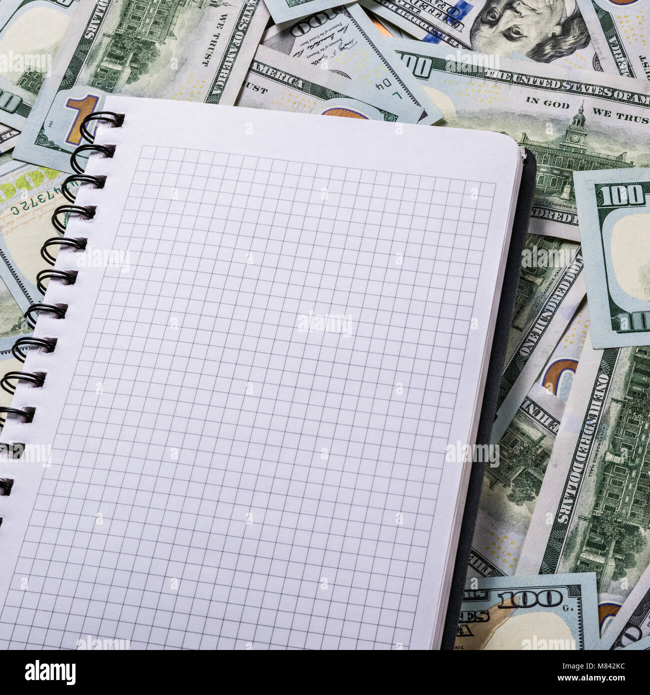 Notebook for notes lying on money background Stock Photo - Alamy