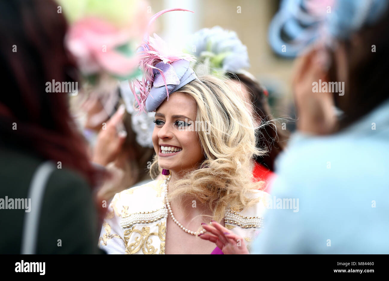 A female racegoer takes part in the Miss Cheltenham finalists line up ...