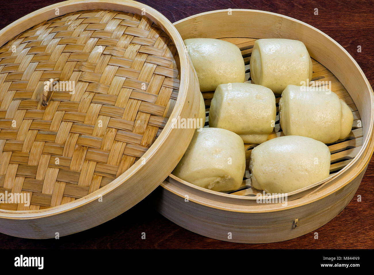 Chinese buns in a bamboo basket Stock Photo - Alamy