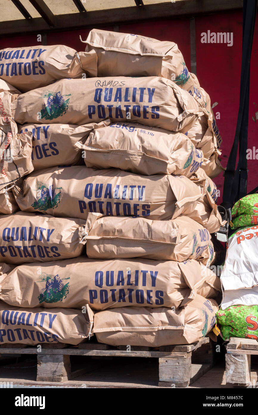Sacks of potatoes stacked on a pallet ready for delivery Stock Photo ...