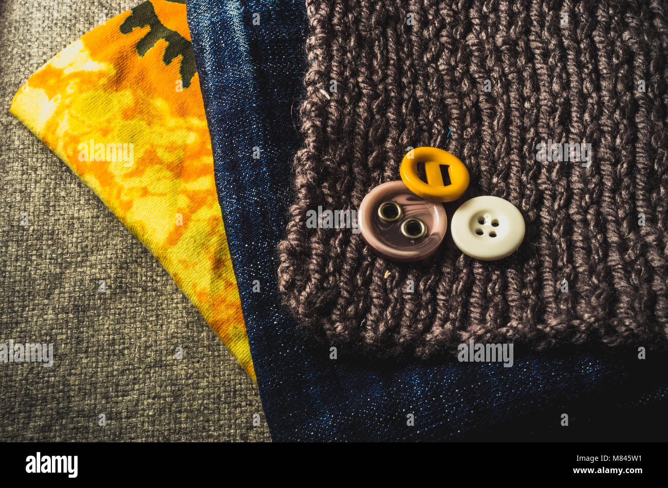 Clothing and textiles patterns with three buttons Stock Photo - Alamy