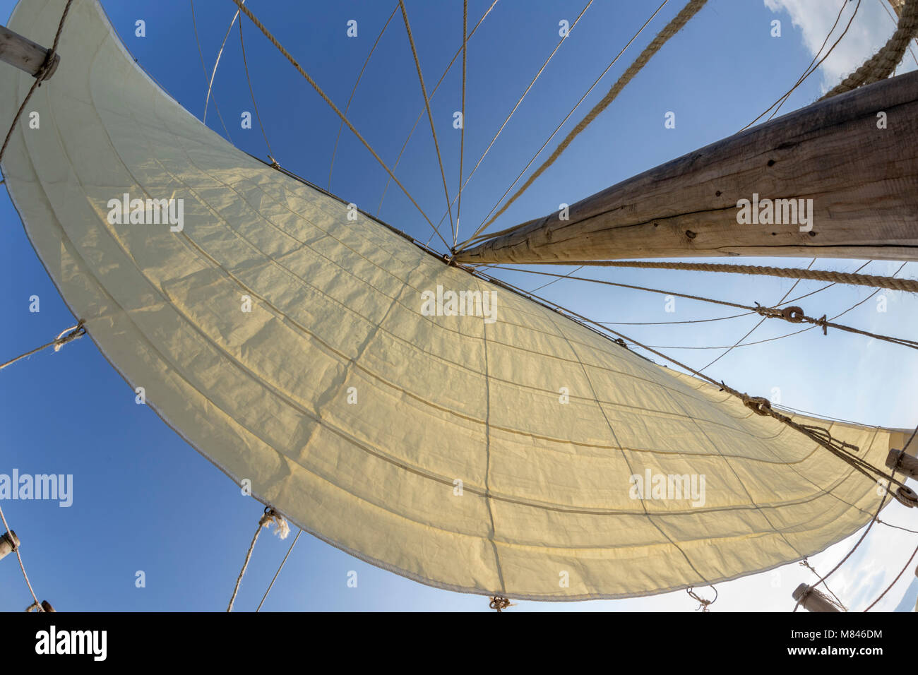 Sailboat. A mast, a guy, a sail. Bottom view Stock Photo - Alamy