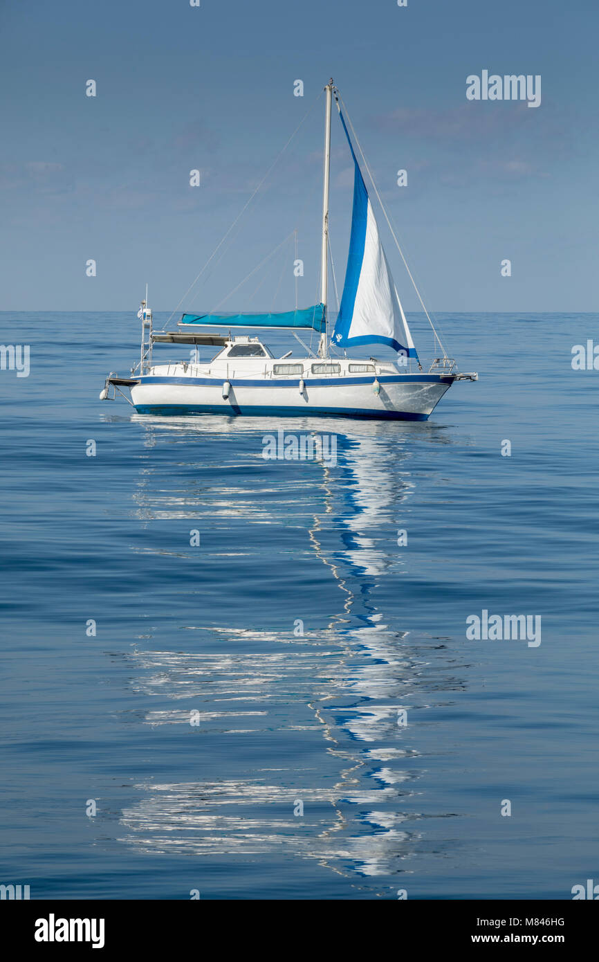 A yacht in the sea. Reflection Stock Photo - Alamy
