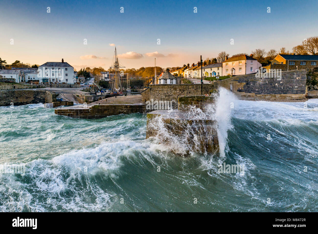 Huge waves dwarf the harbour at Charlestown as Storm Emma makes ...