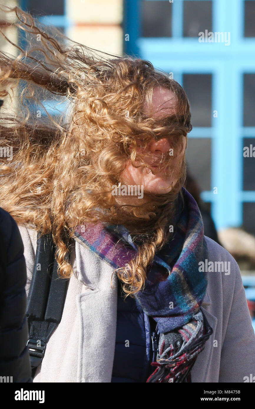 People out and about on a sunny but cold and windy day in Alexandra ...