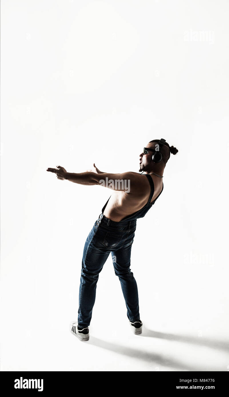 rapper shirtless with headphones and a stylish hairdo and arms e Stock ...