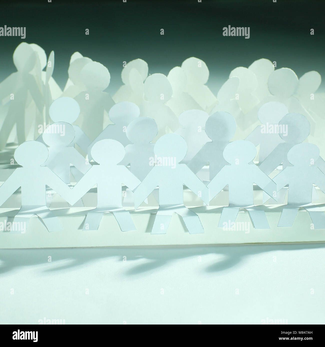 business concept.a large team of paper doll Stock Photo - Alamy