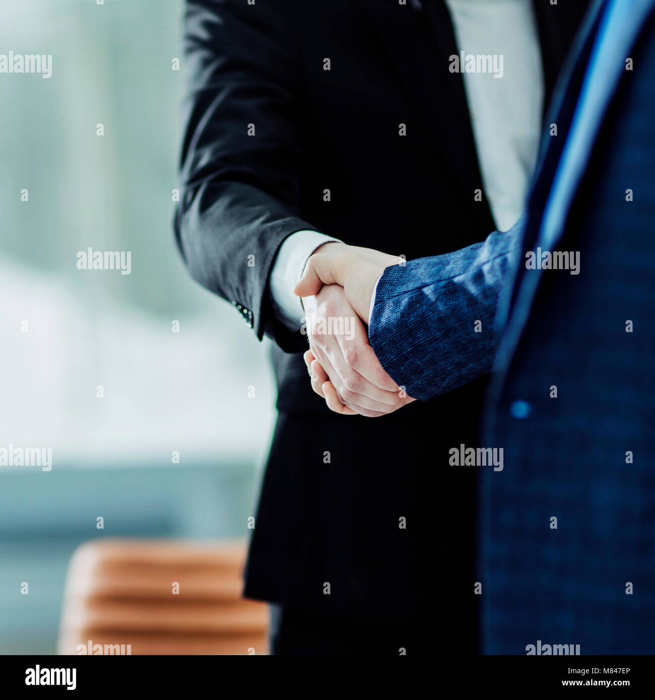 success concept in business - handshake of business partners on the ...