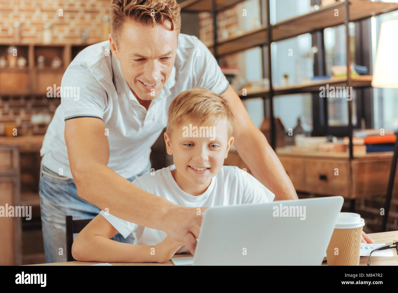 Joyful positive man standing behind his son Stock Photo - Alamy Joyful positive man standing behind his son Stock Photo - Alamy