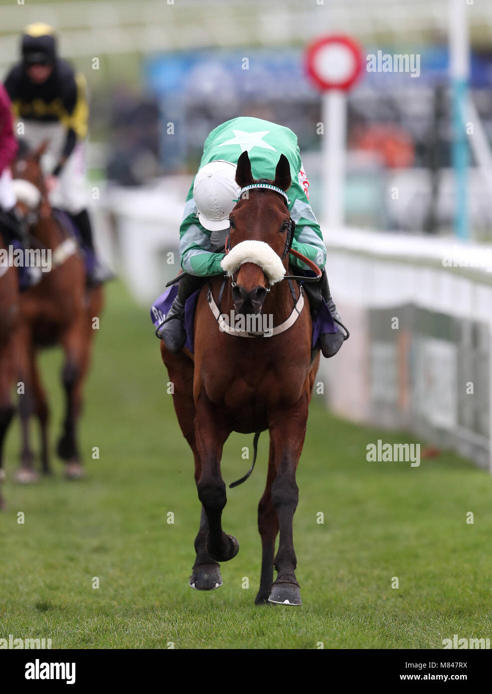 Presenting Percy ridden by jockey Davy Russell coming home to win the ...