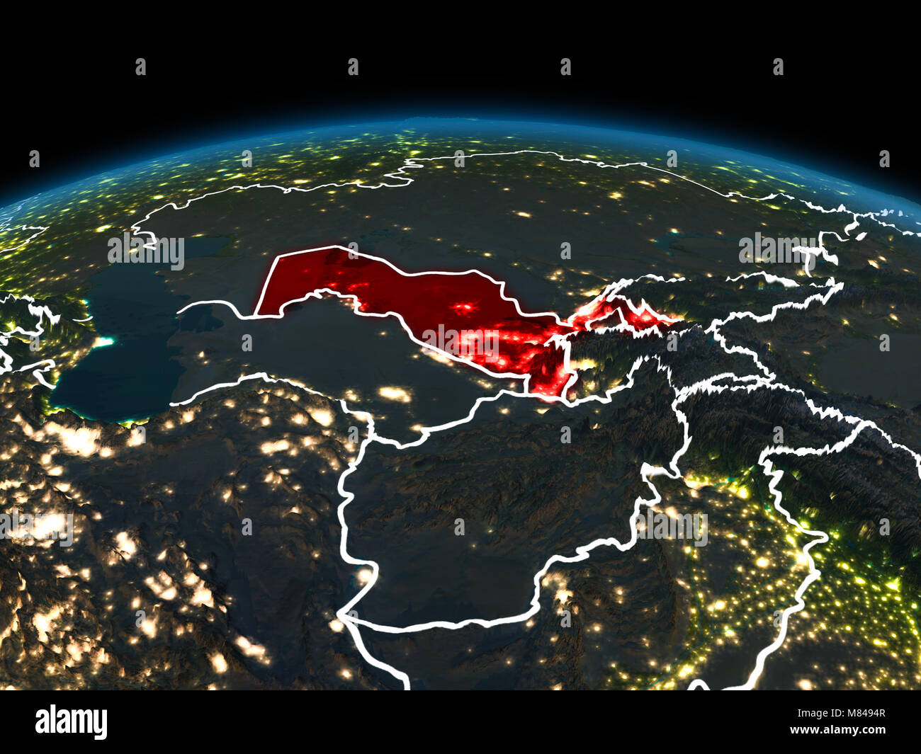 Space orbit view of Uzbekistan highlighted in red on planet Earth at night with visible country ...