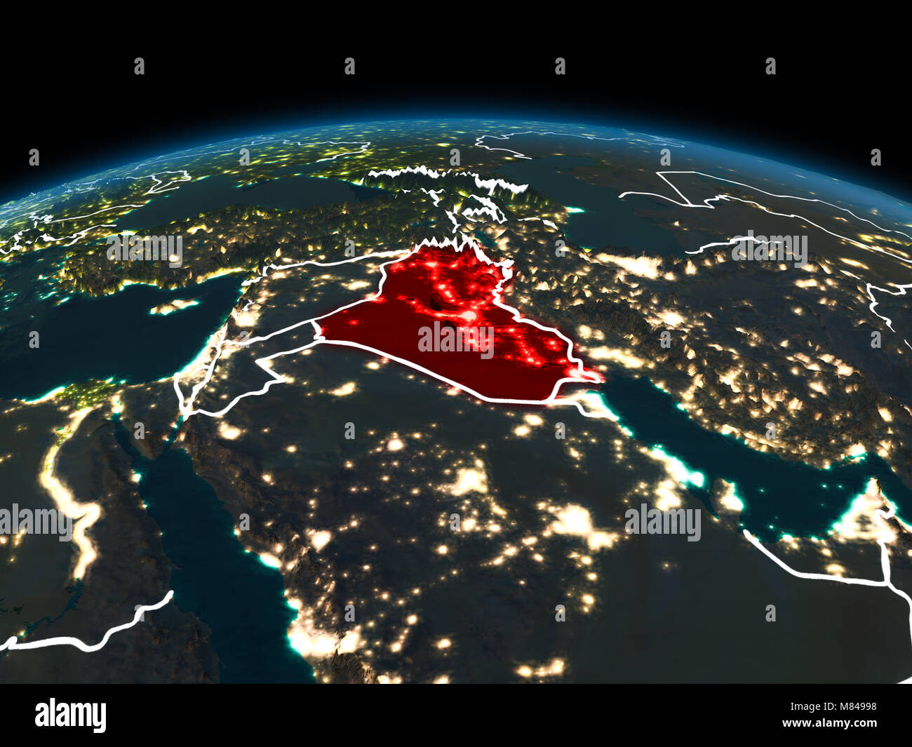 Space orbit view of Iraq highlighted in red on planet Earth at night with visible country ...