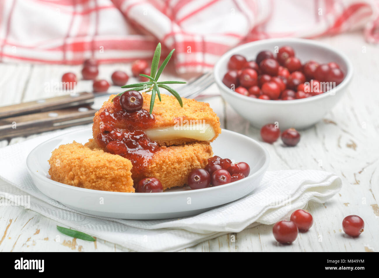 Baked Camembert (brie) with fresh berries and cranberry sauce with ...