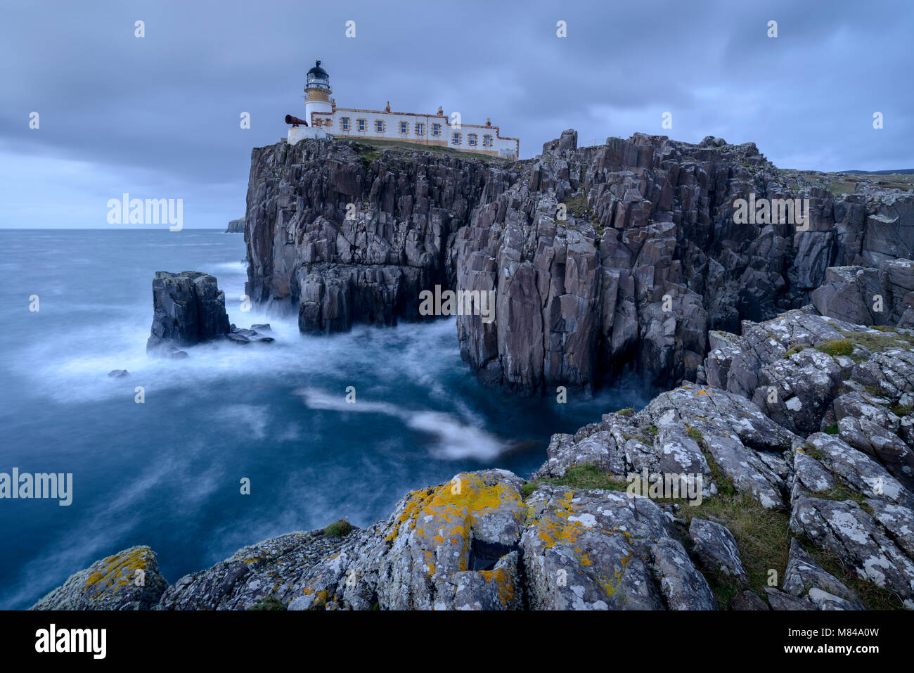 Neist Point lighthouse, perched on dramatic cliff tops on the west ...
