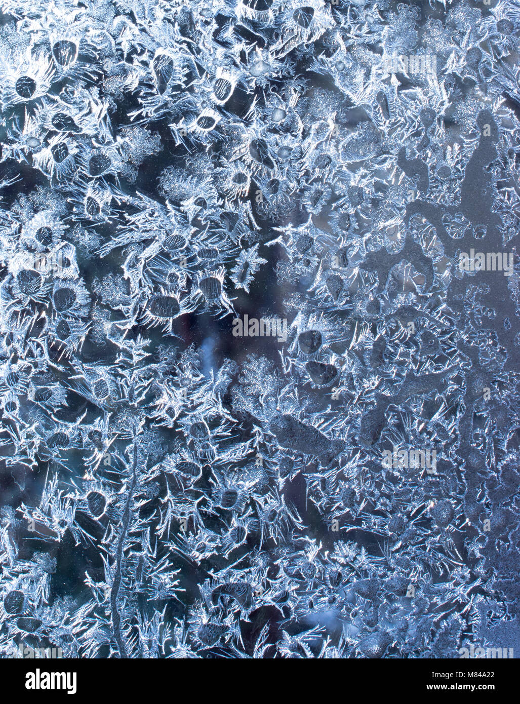 Ornaments on the window created by frost. Frozen water on the window ...