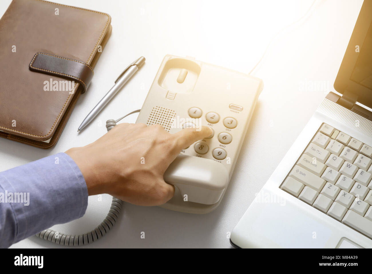 businessman dial digital telephone with office background Stock Photo ...