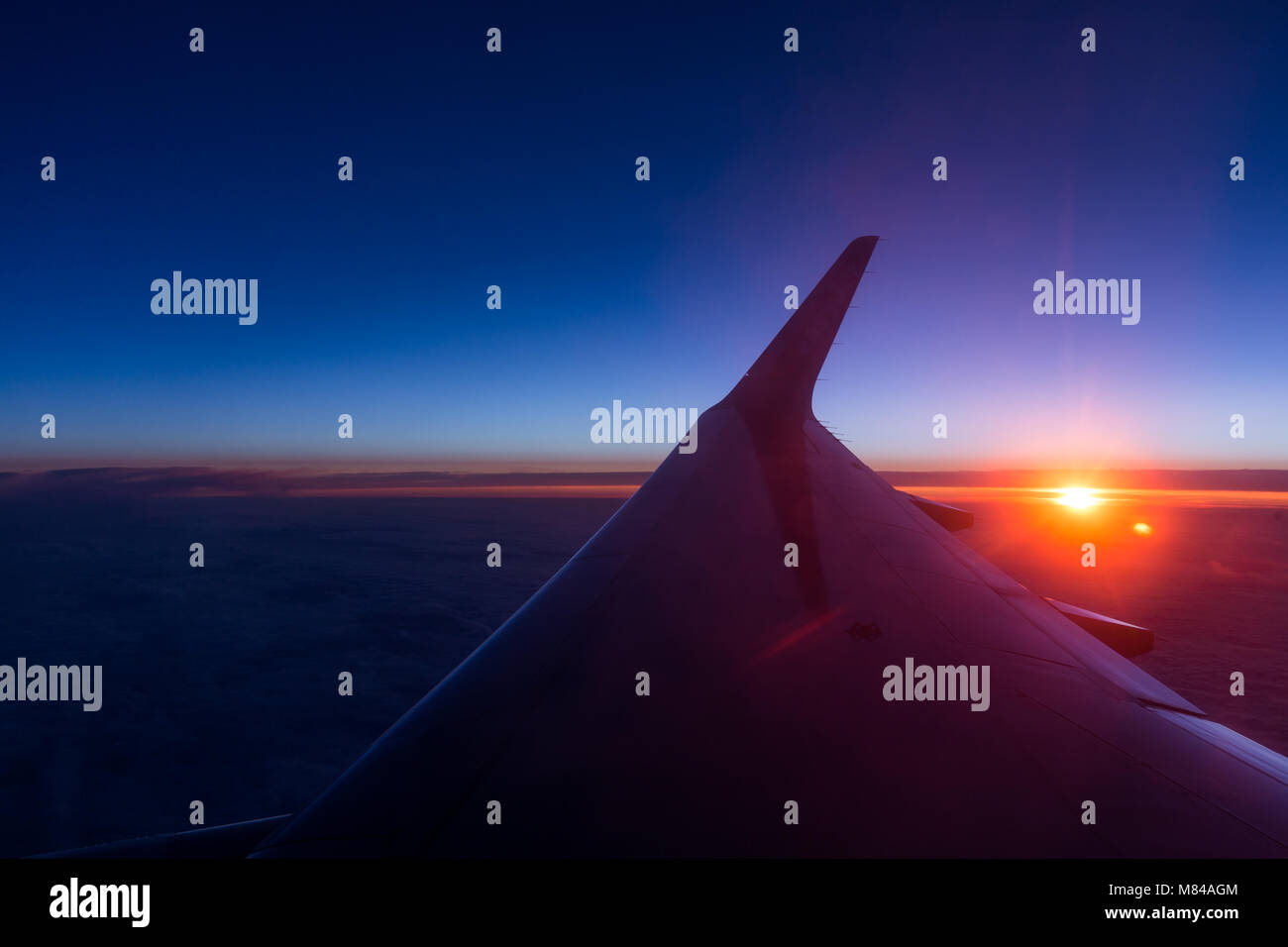 Sunset on the plane Stock Photo - Alamy
