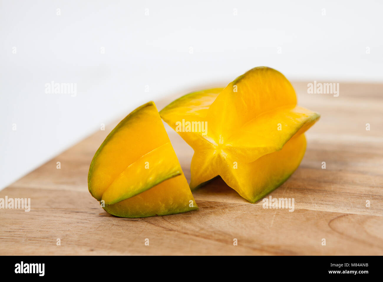 Exotic starfruit or averrhoa carambola on wooden cut board Stock Photo ...