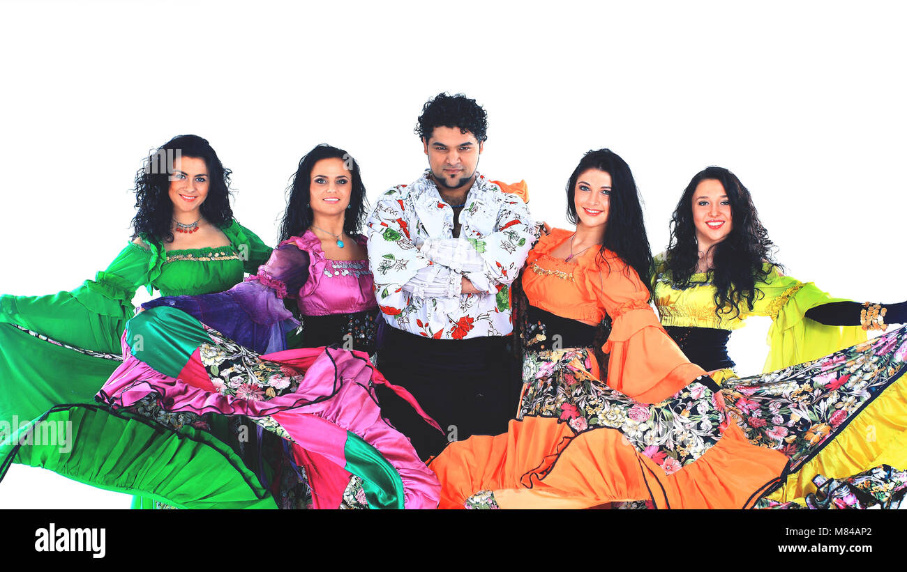 Dance group of gypsies, dancing and waving their magnificent dresses ...