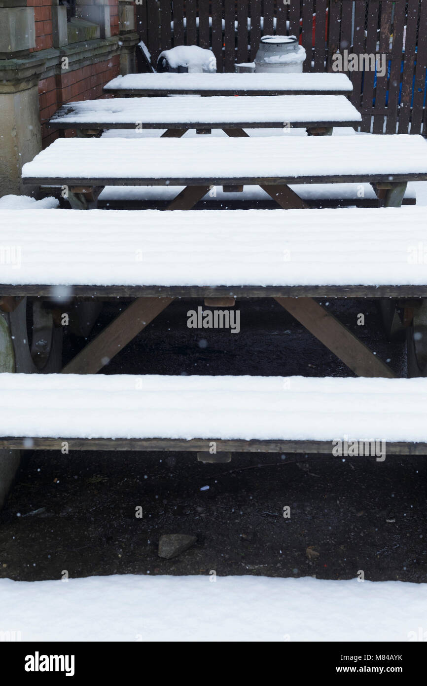 Snow covered benches outside 'The Library' pub, Woodhouse, Leeds ...