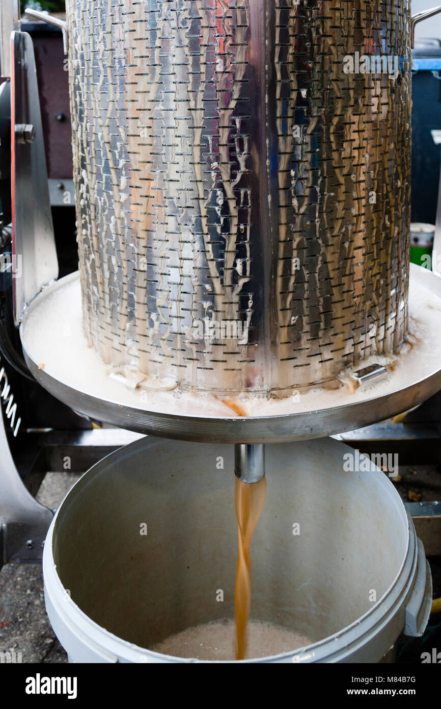 The hydraulic apple press during the Craft Apple Juice manufacturing in ...