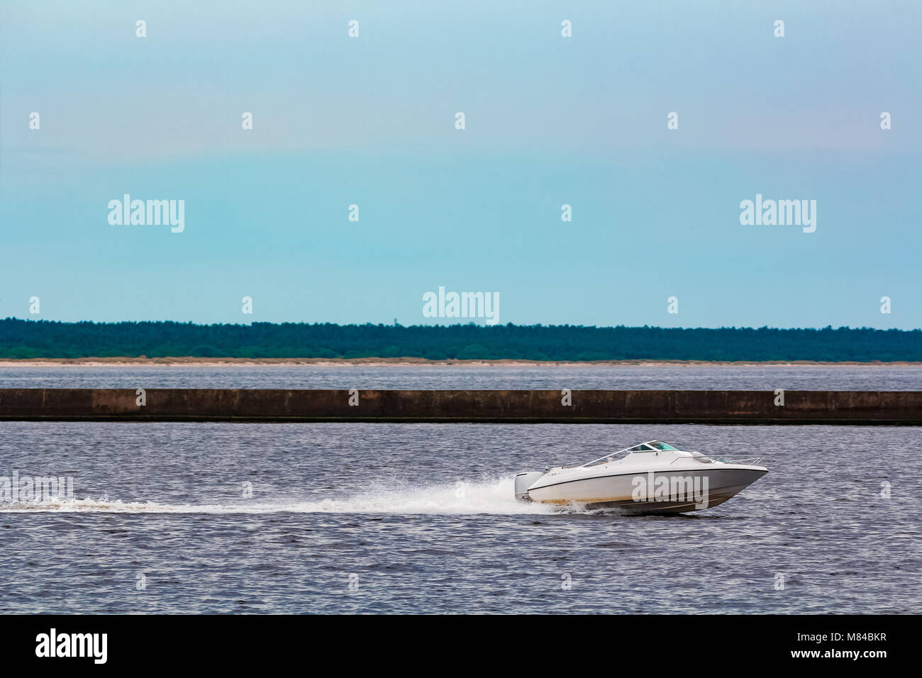 White speed boat moving fast to the Baltic sea. Water sport Stock Photo ...