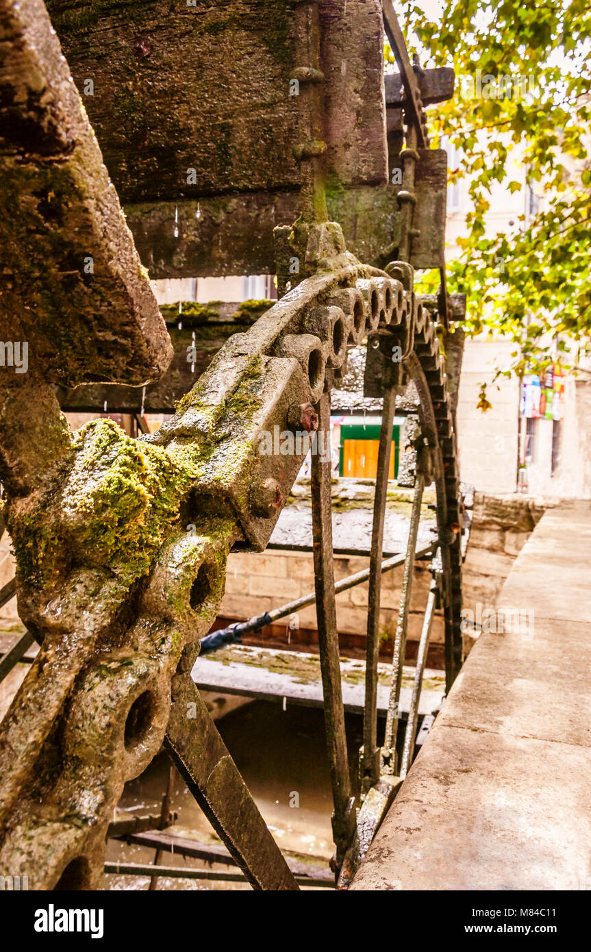 Medieval rusty mossy metal wooden watermill fragment in Avignon France ...