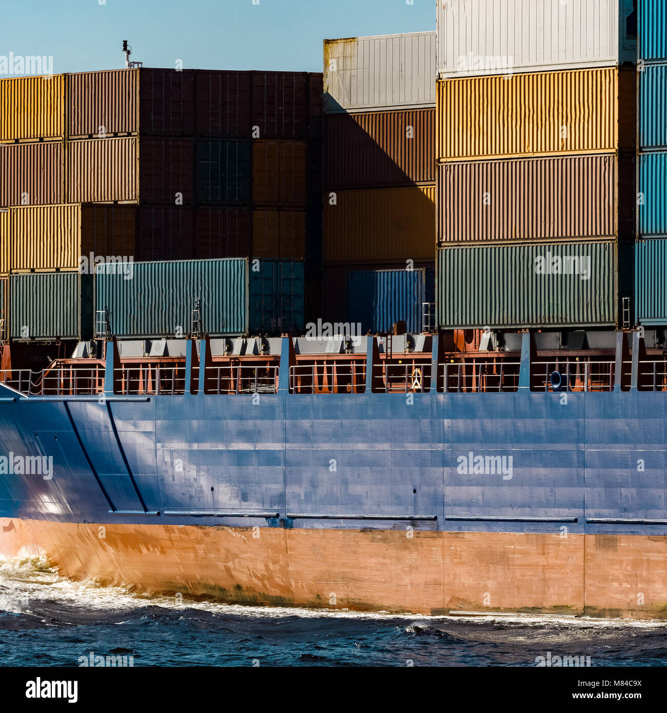 Blue container ship in travel. Logistics and freight industry Stock ...