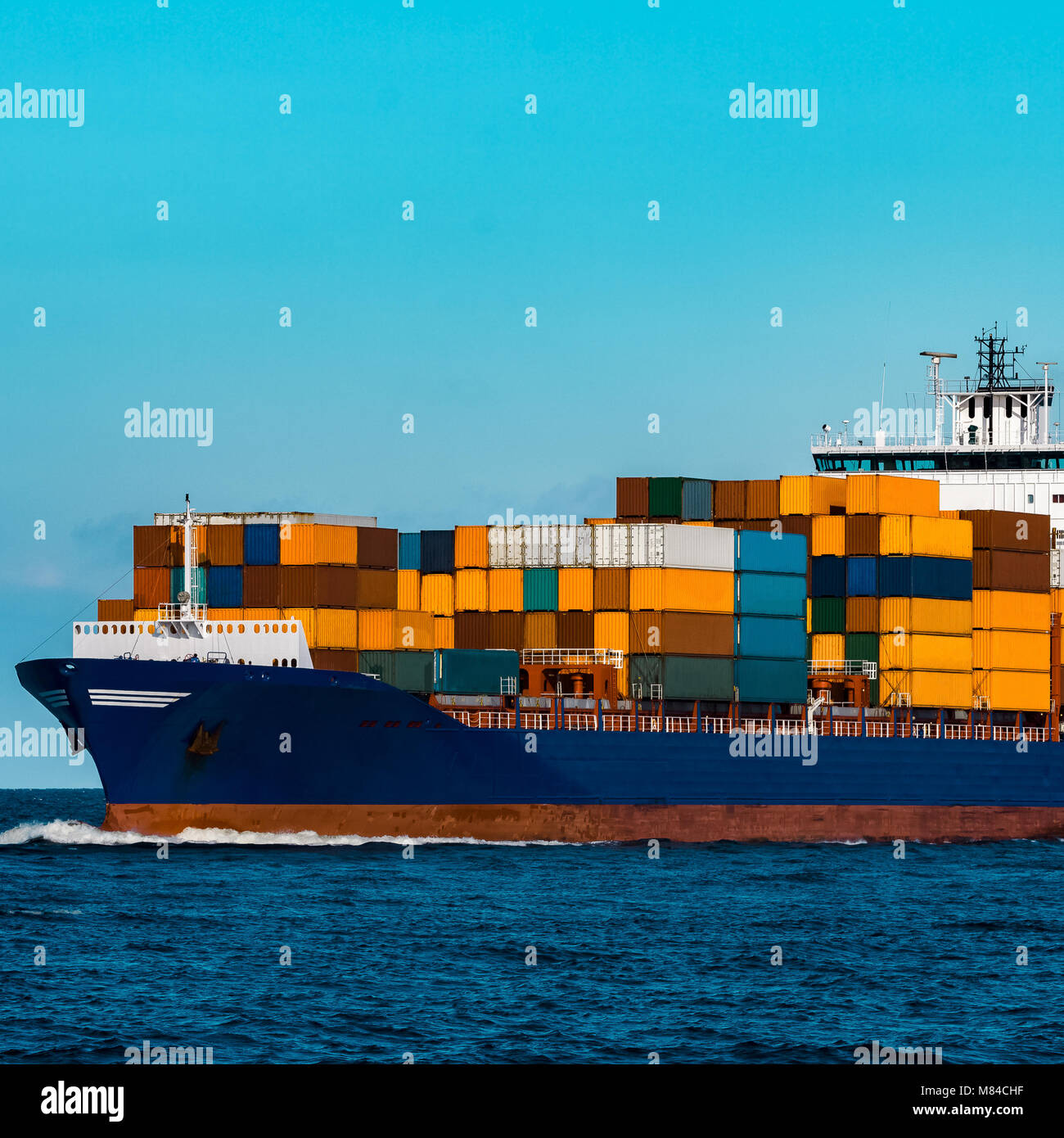 Blue container ship in travel. Logistics and freight industry Stock ...