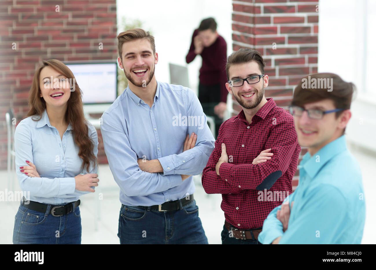 Happy smiling business team in office Stock Photo - Alamy