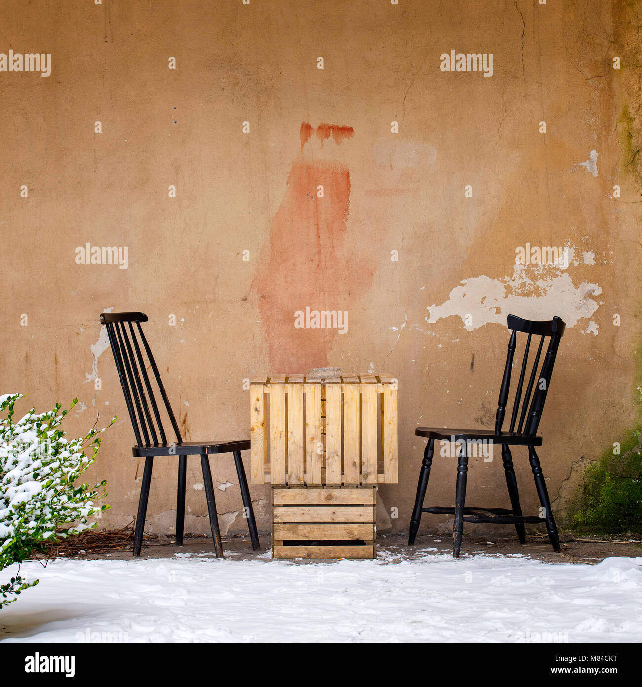 table and two chairs near the wall Stock Photo - Alamy