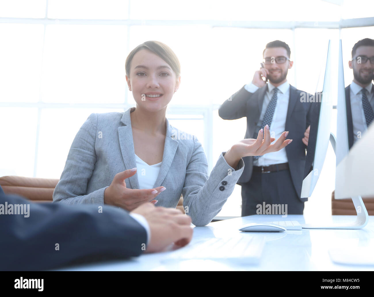 female consultant communicating with the client Stock Photo - Alamy