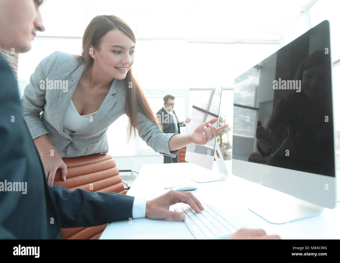 business woman pointing at the computer screen Stock Photo - Alamy